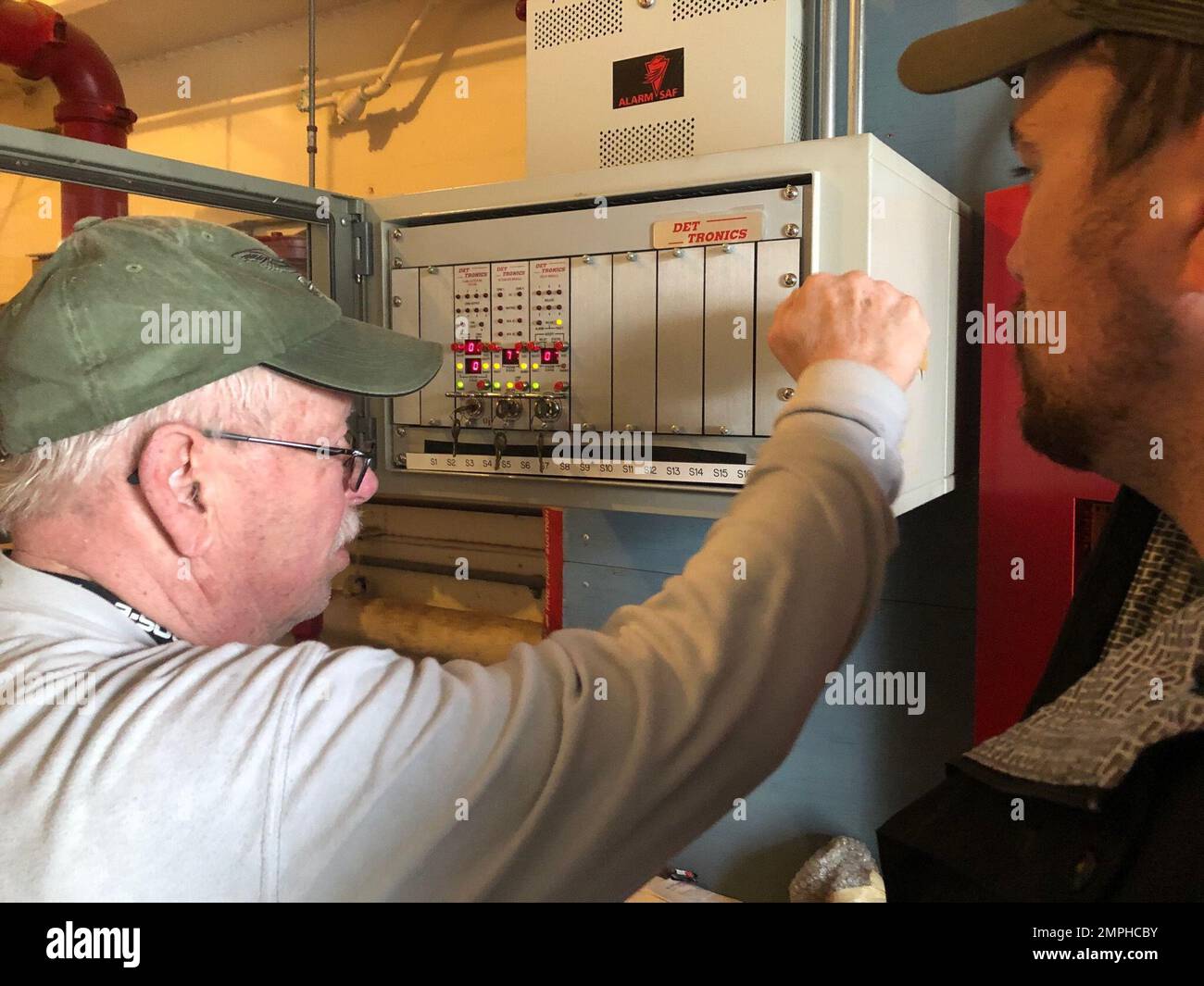 Clarence (Pat) Levesque (left), fire alarm technician for NAVFAC ...