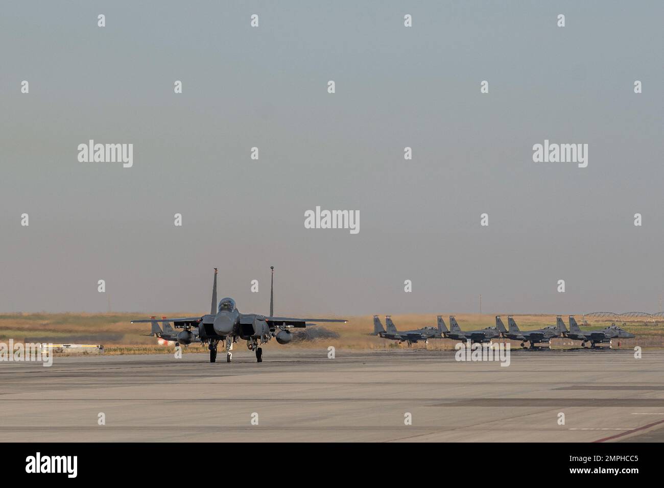 U.S. Air Force F-15E Strike Eagles taxi on the flight line in ...