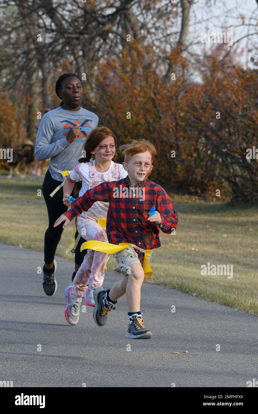 Members of the 319th Reconnaissance Wing participate in a zombie run ...