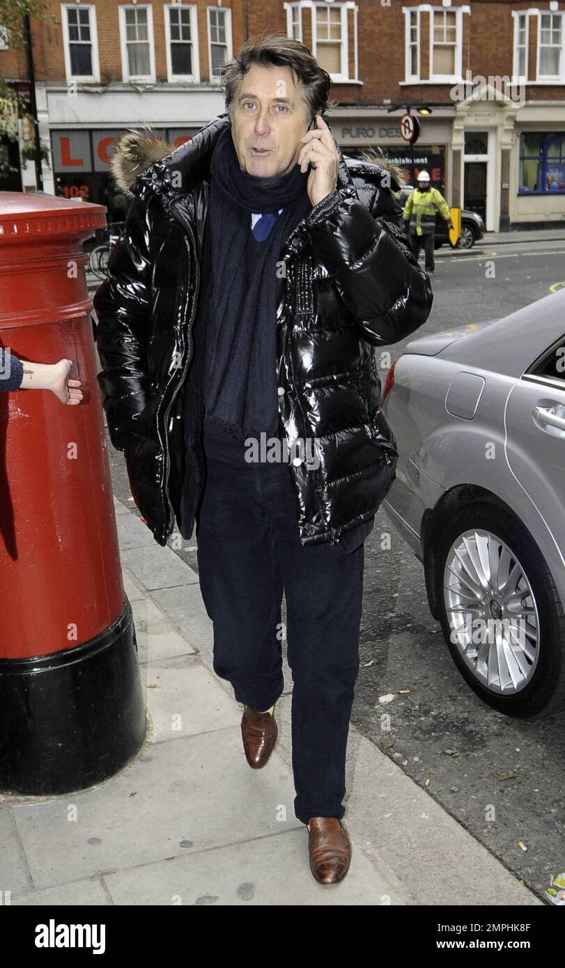 Bryan Ferry chats on his cellphone as he arrives at BBC Radio 2. Ferry ...