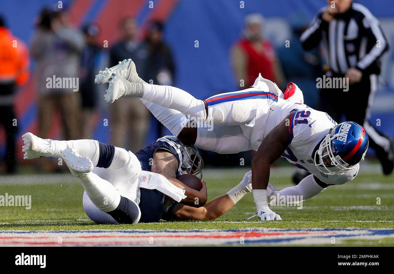 Dallas Cowboys quarterback Zac Dysert (4) slides under New York Giants ...