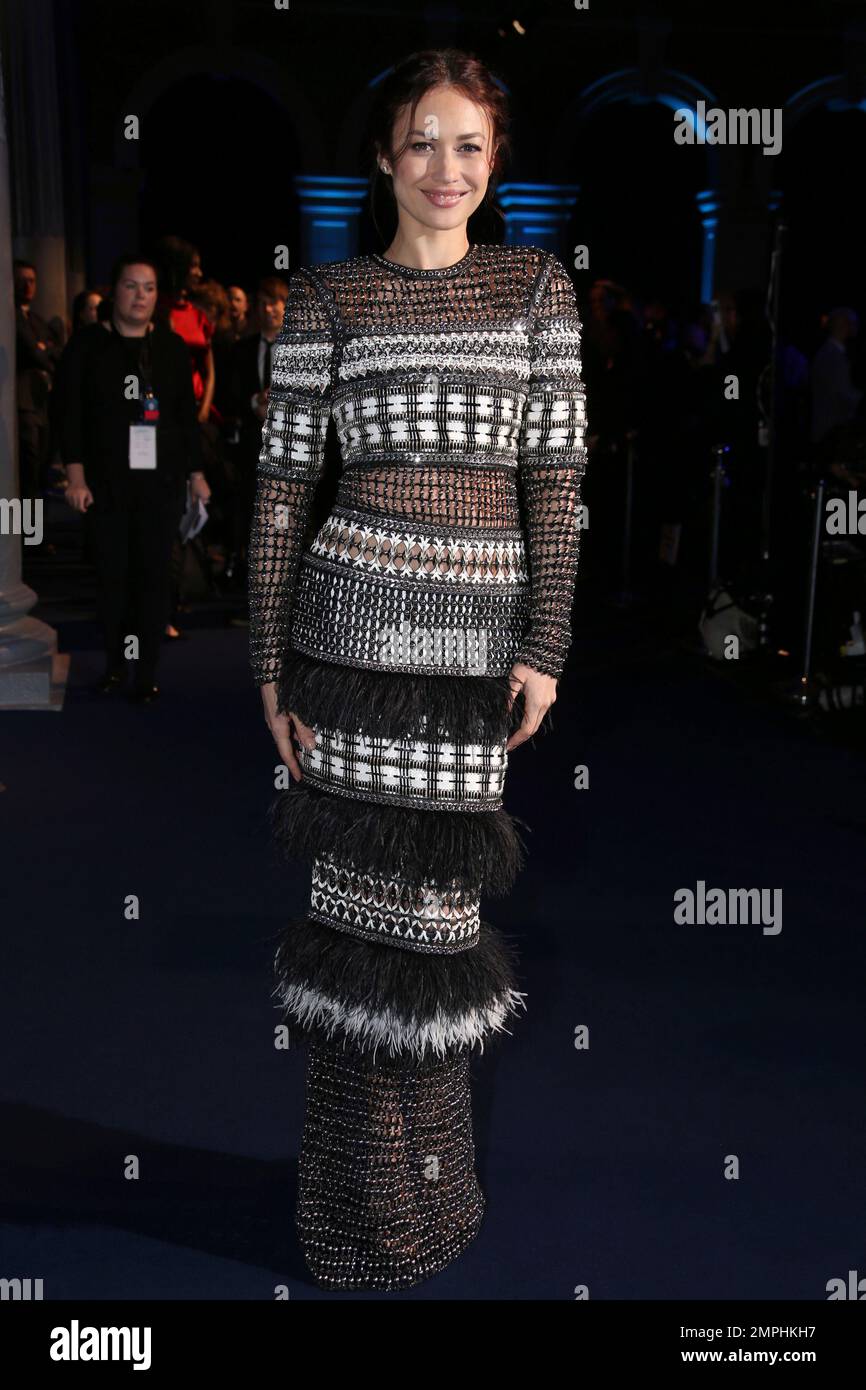 Actress Olga Kurylenko poses for photographers upon arrival at the ...