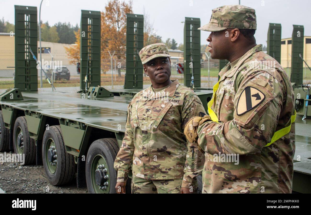 The 405th Army Field Support Brigade commander speaks to a Soldier from ...