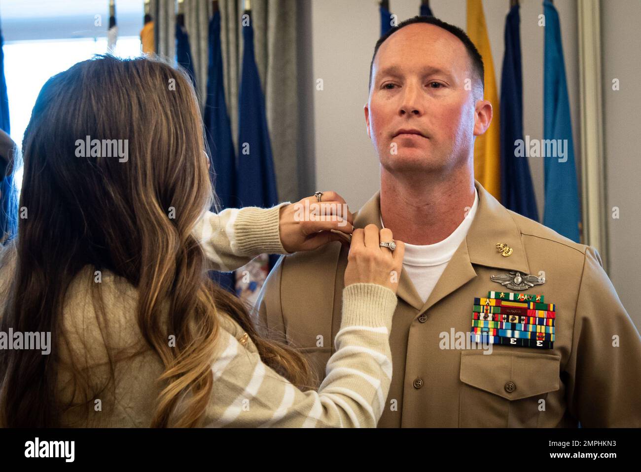Chief petty Officer Shaun Gafford receives his new rank from his wife ...