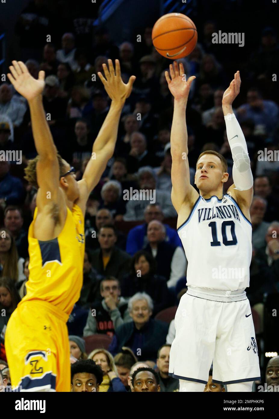 Villanova guard Donte DiVincenzo (10) takes a three point shot over La ...
