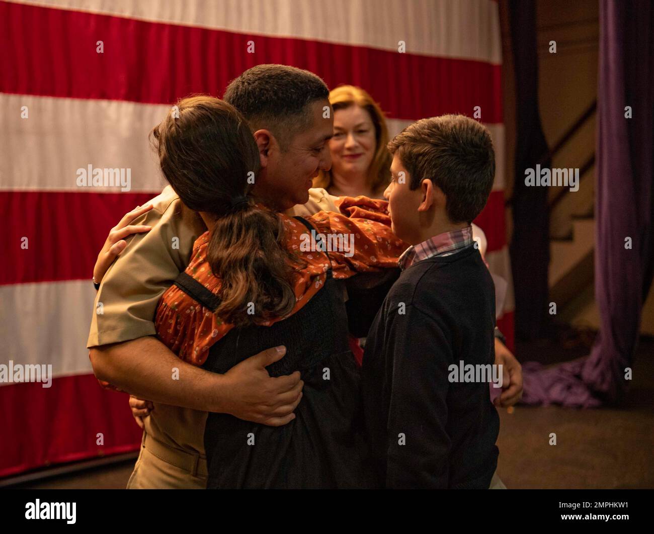 Chief Musician David Gonzalez Is Pinned By Family Members During A chief-musician-david-gonzalez-is-pinned-by-family-members-during-a