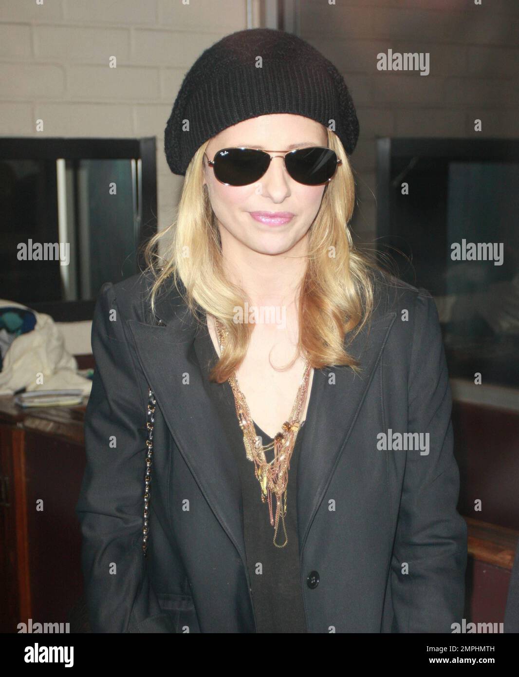 Sarah Michelle Prinze smiles for the cameras as she leaves after a ...