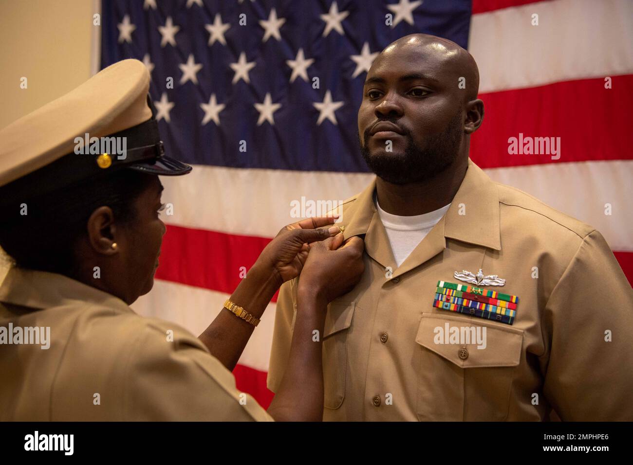 NAVAL STATION NORFOLK (Oct. 21, 2022) A chief petty officer mentor pins ...