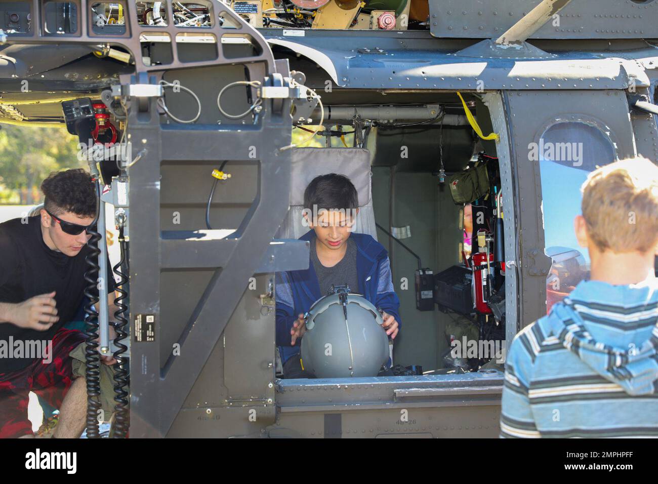 Children explore the inside of a UH-60 Black Hawk helicopter at Kent ...