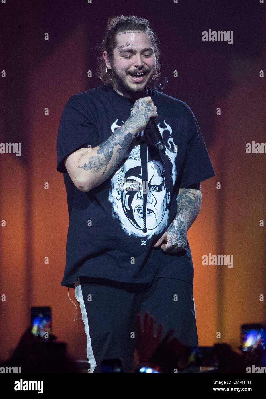 Post Malone performs on stage during the 2017 iHeartRadio Jingle Ball ...