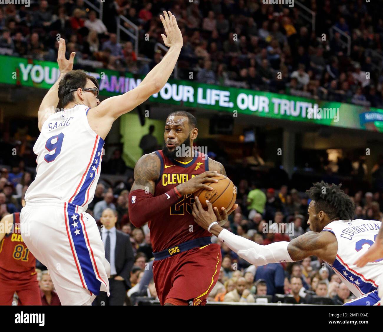 Cleveland Cavaliers' LeBron James drives between Philadelphia 76ers ...