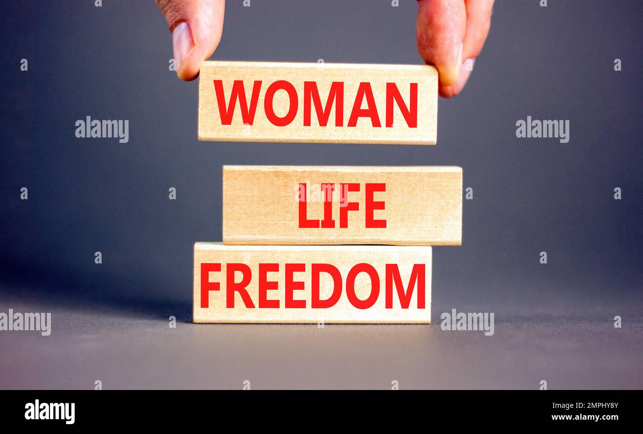 Woman life freedom symbol. Concept words Woman Life Freedom on wooden ...
