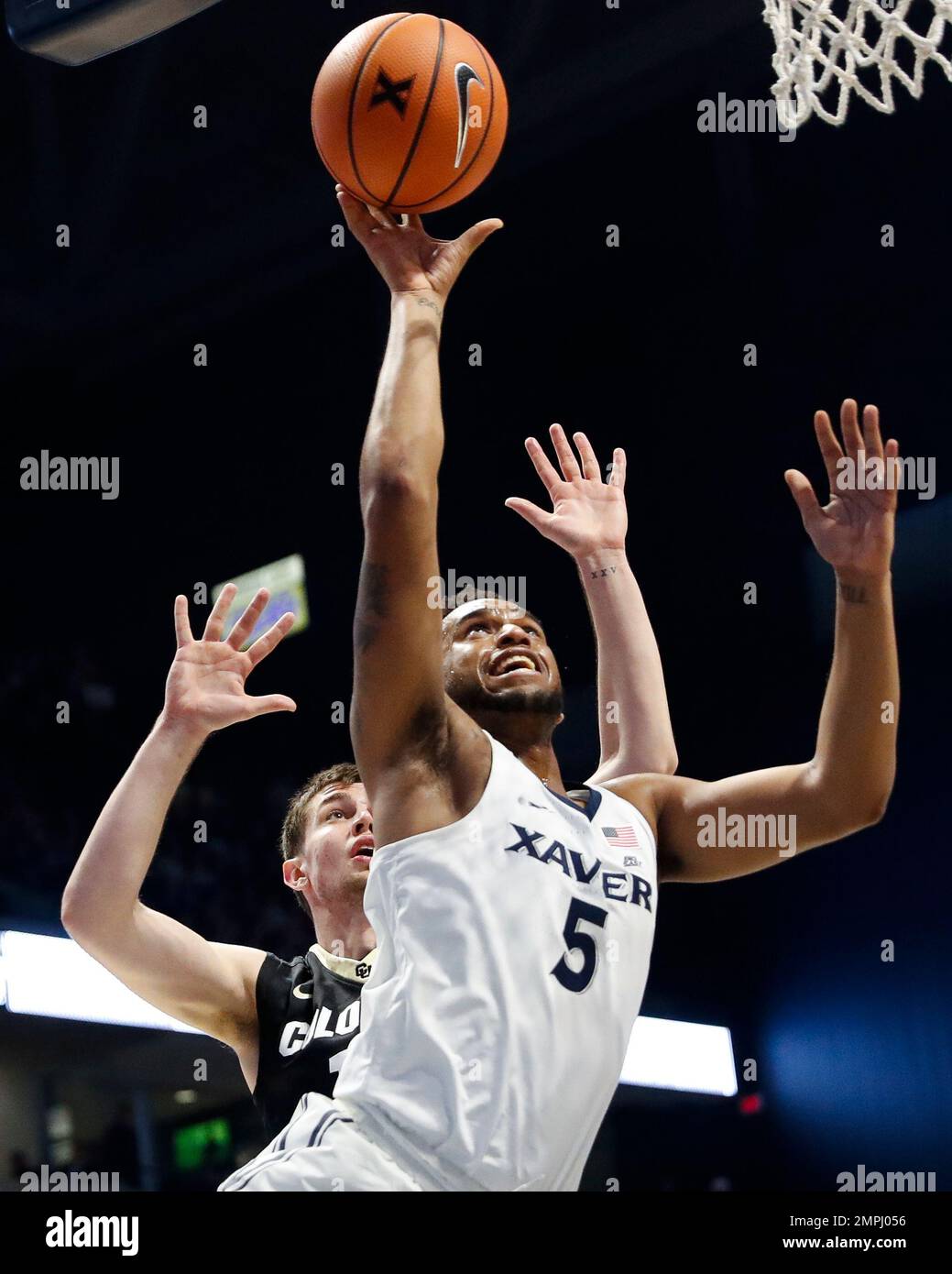 Xavier's Trevon Bluiett (5) shoots against Colorado's Lazar Nikolic ...