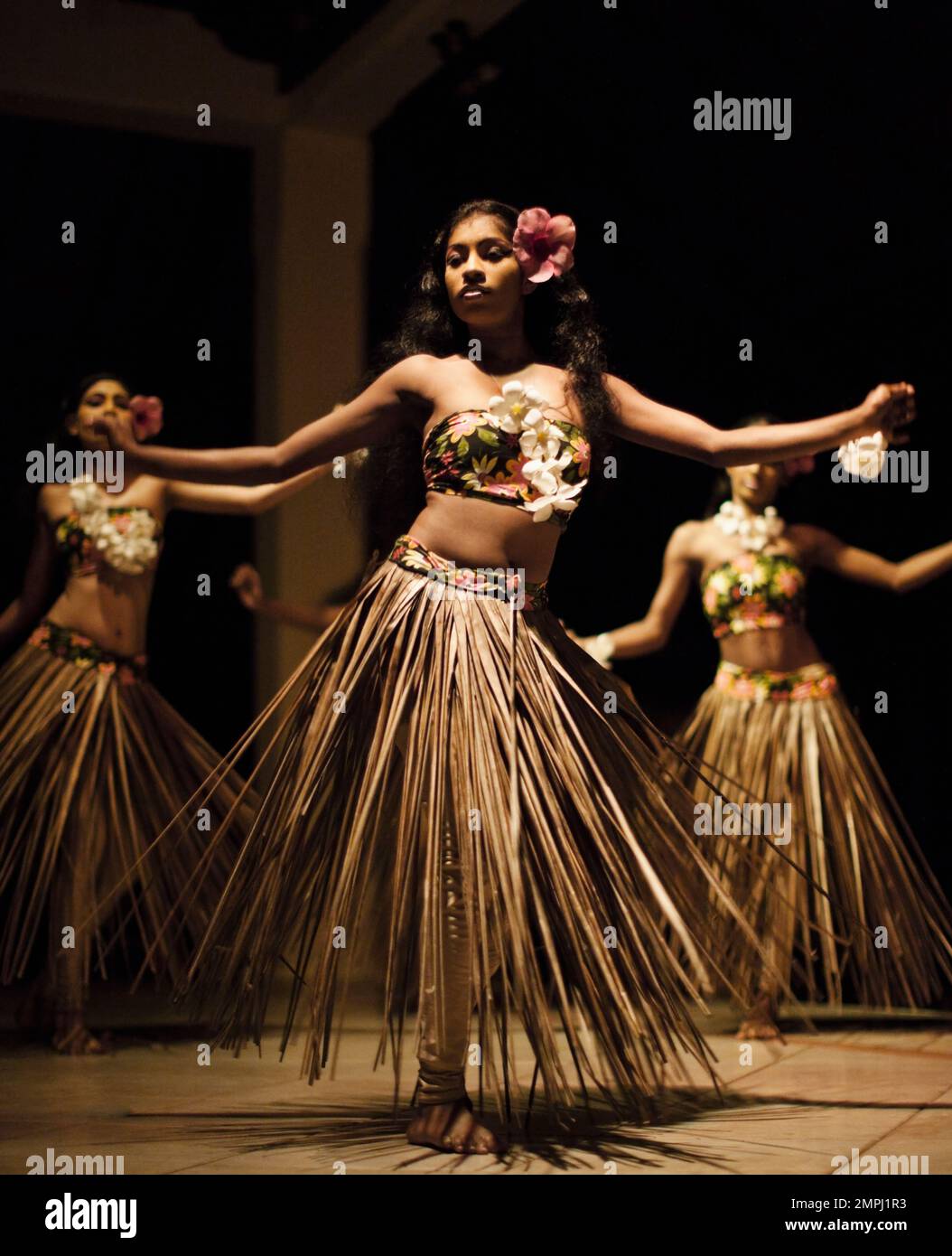 Traditional dancers perform at a Sri Lankan resort. Bentota, Sri Lanka ...