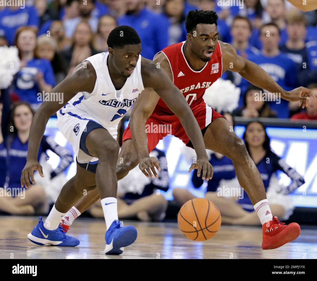 Creighton's Khyri Thomas (2) and Nebraska's Duby Okeke (0) chase a ...