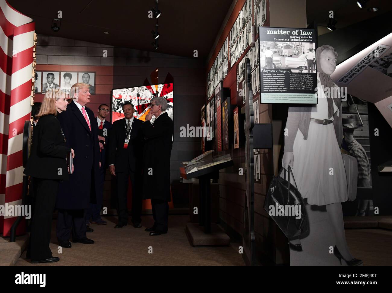 President Donald Trump, second from left, gets a tour of the newly ...