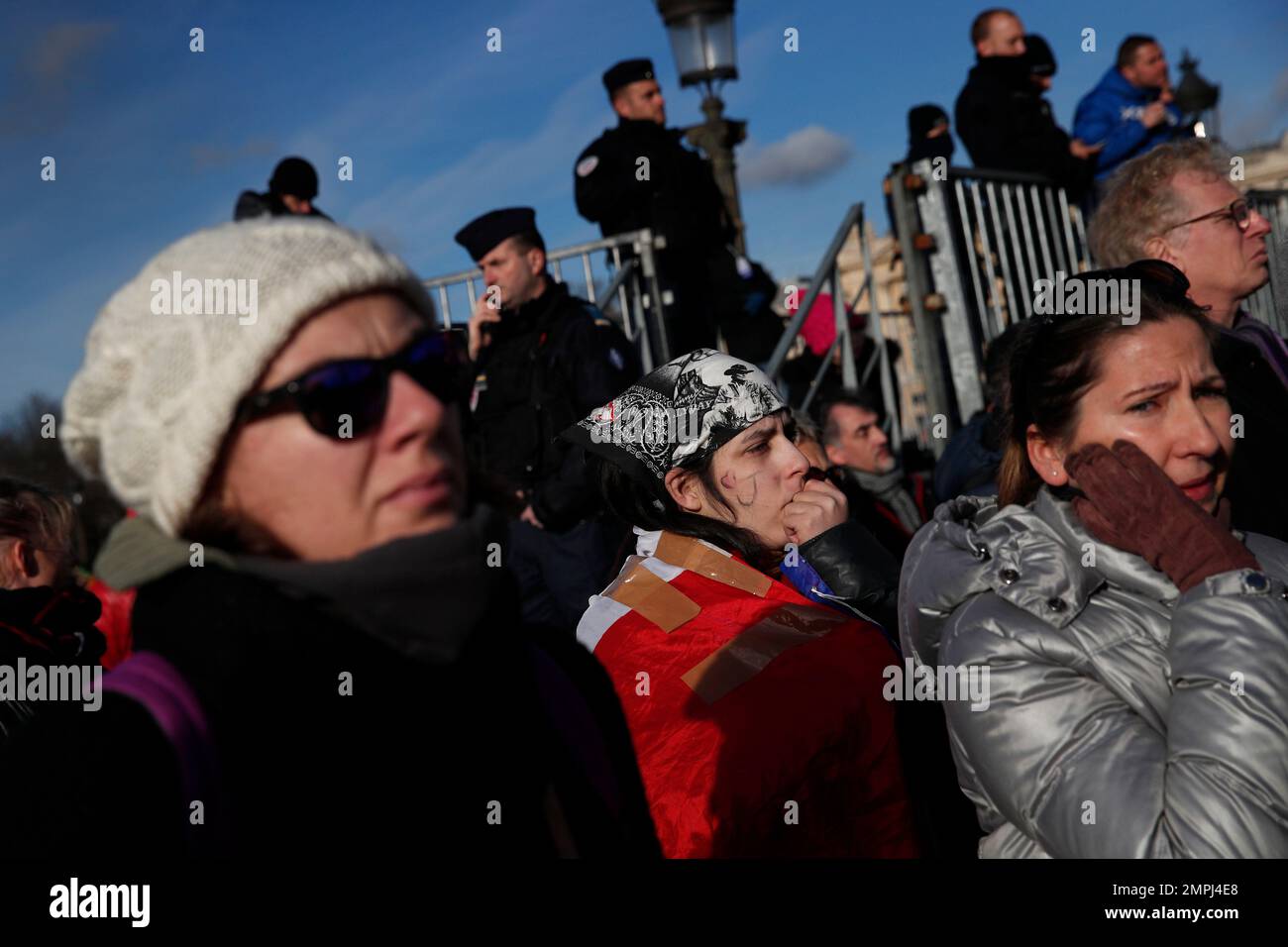 Fans watch on a giant screen French rock star Johnny Hallyday's funeral ...