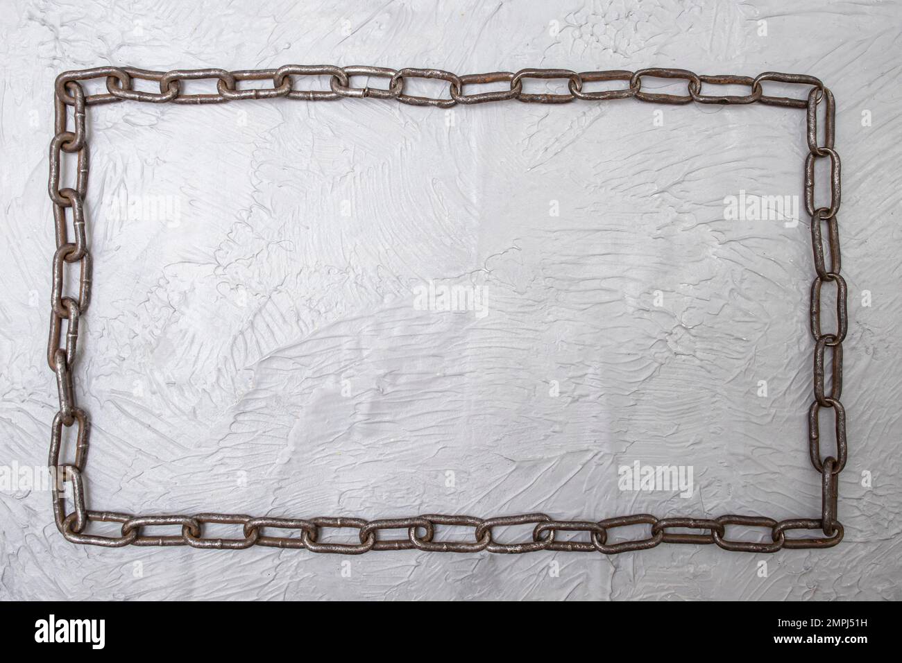 Continuous chain frame flat lay on gray cement background, template ...