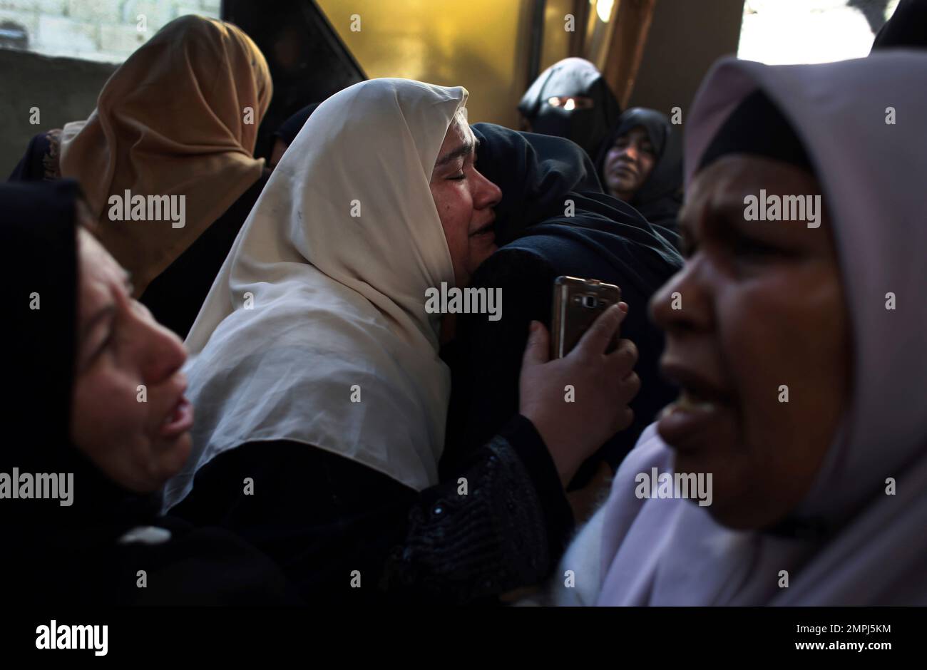 Relatives of 30-year-old Mohammed Al-Masri, who was killed during ...