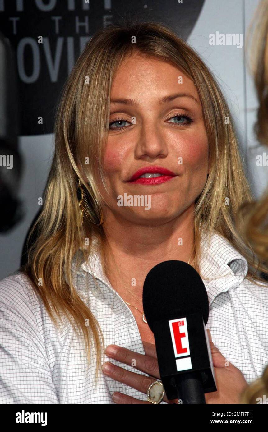 Cameron Diaz is escorted by a bodyguard as she arrives at the AFI Night ...
