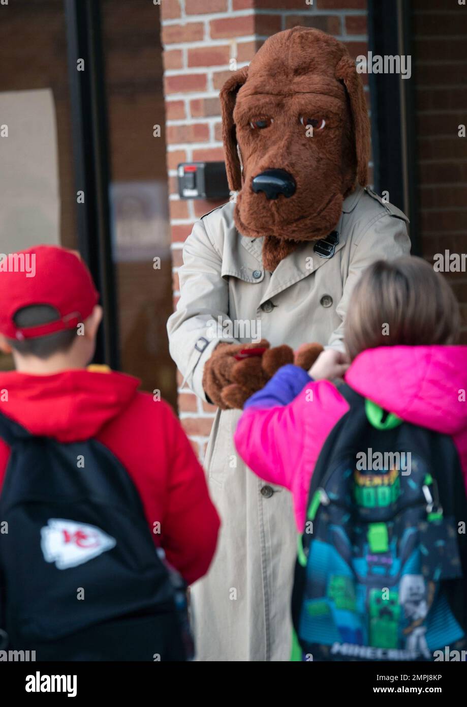 McGruff the Crime Dog hands out red ribbons to students as they enter C ...