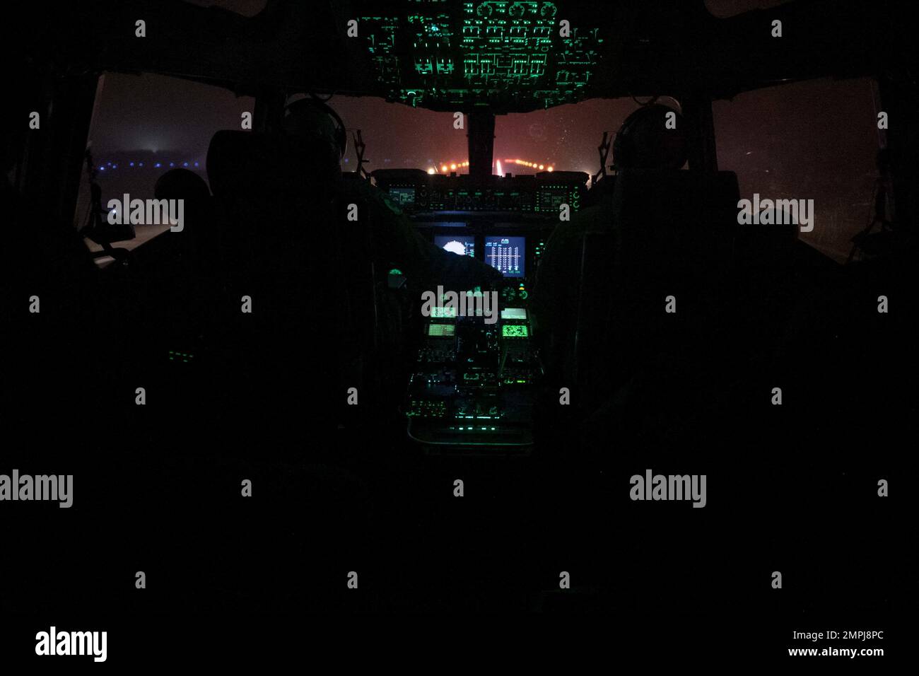 Pilots from the 3rd Airlift Squadron land a C-17 Globemaster III during ...