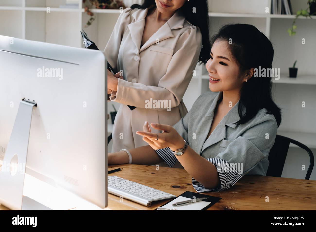 Business woman or accountant making working audit with her team ...