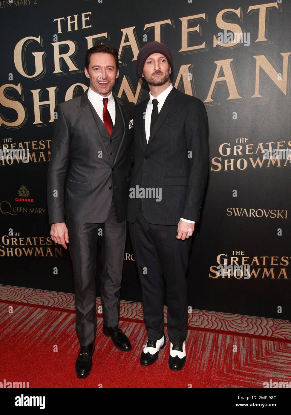 Hugh Jackman, left, and Michael Gracey, attend the world premiere of ...