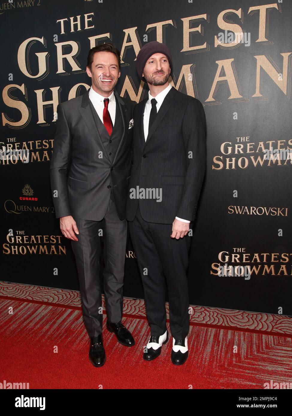 Hugh Jackman, left, and Michael Gracey, right, attend the world ...