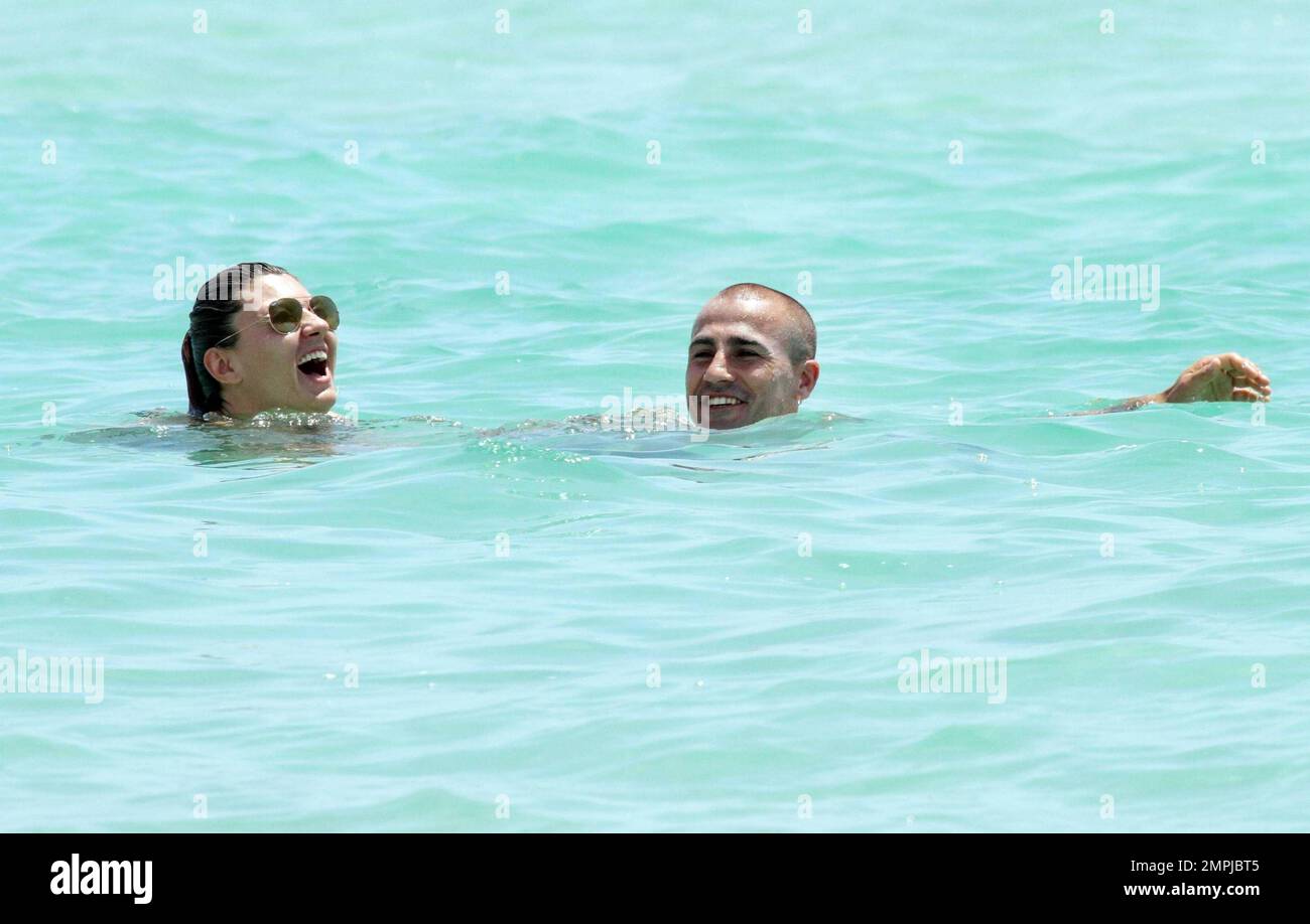 Fabio Cannavaro and his curvy wife Daniela, soak up the sun during a ...