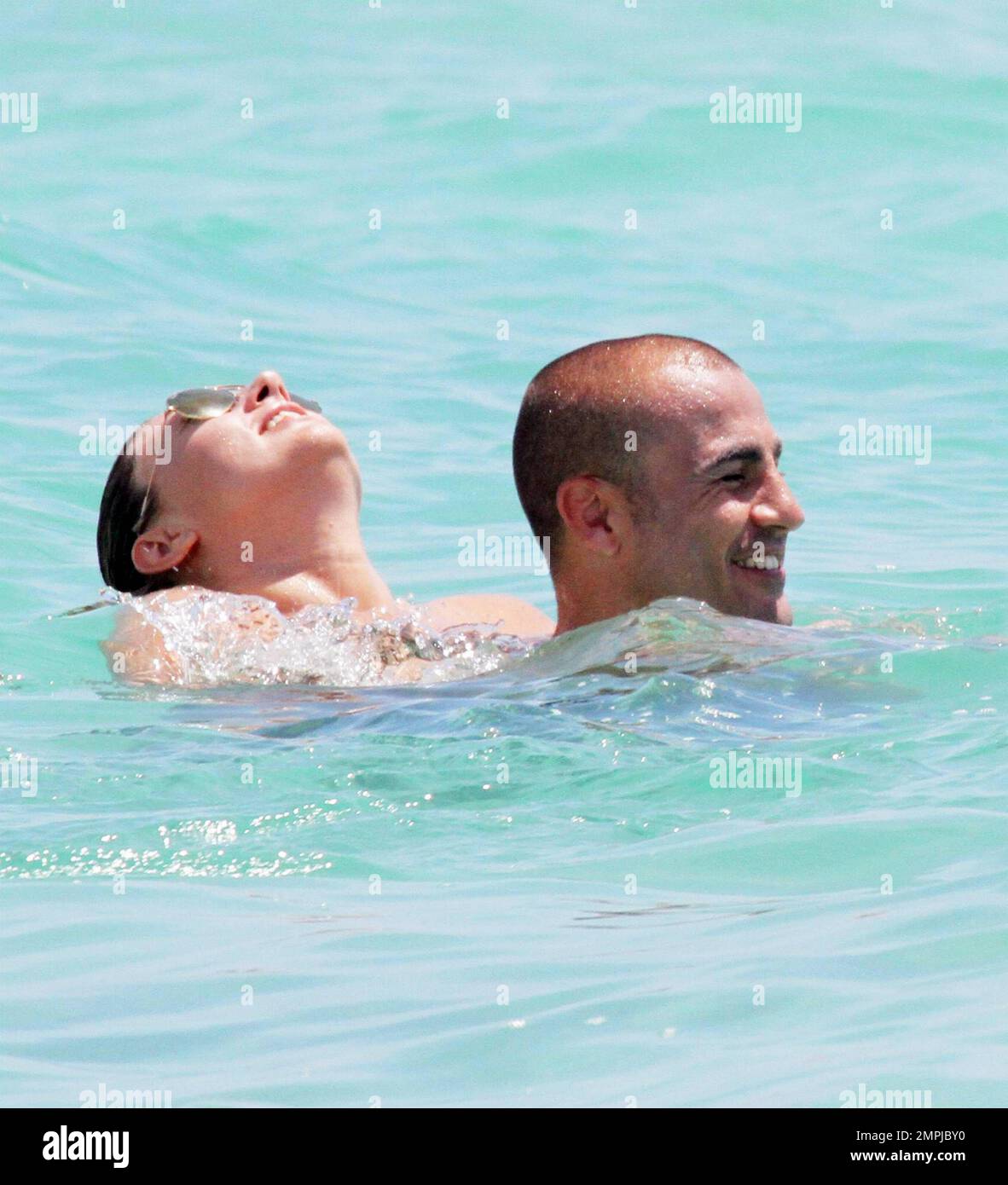 Fabio Cannavaro and his curvy wife Daniela, soak up the sun during a ...