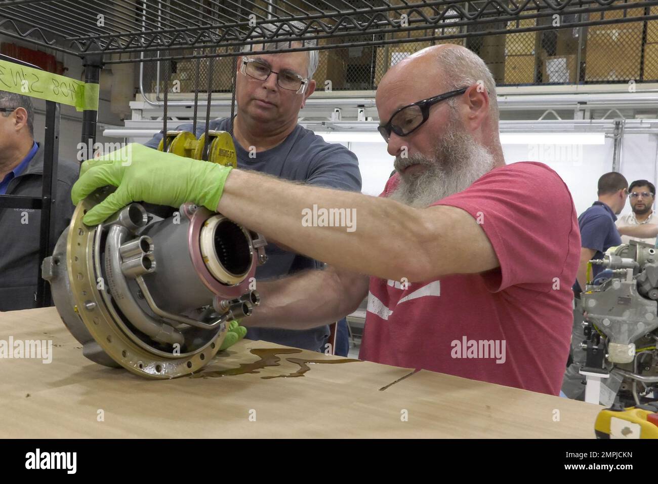 Fleet Readiness Center East (FRCE) engine mechanics Mark Schexnayder ...