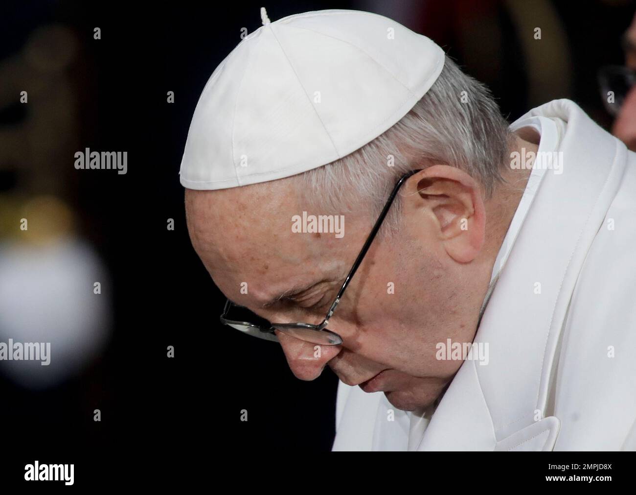 Pope Francis prays in front of the statue of the Virgin Mary, near Rome ...