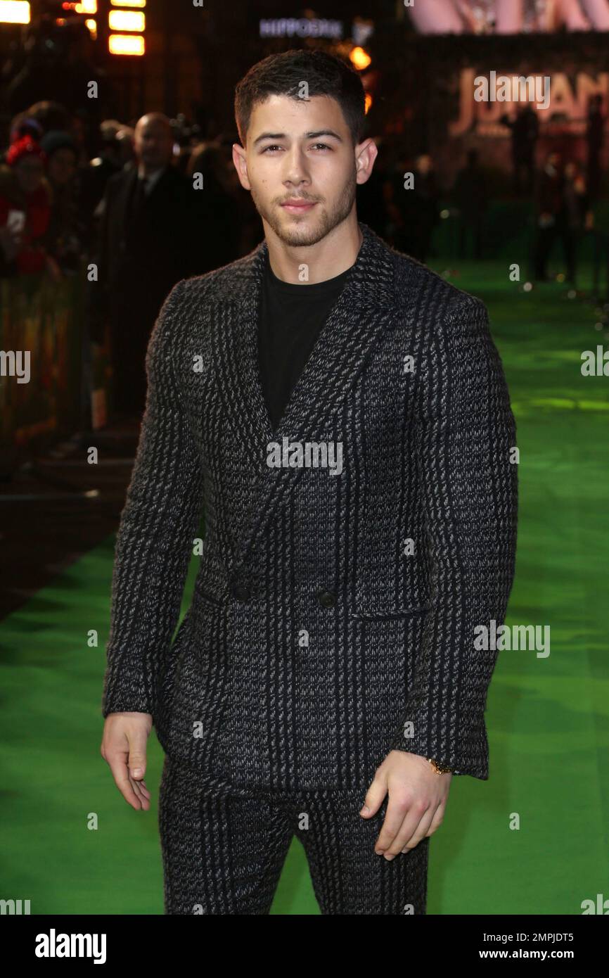Actor Nick Jonas poses for photographers upon arrival at premiere of ...