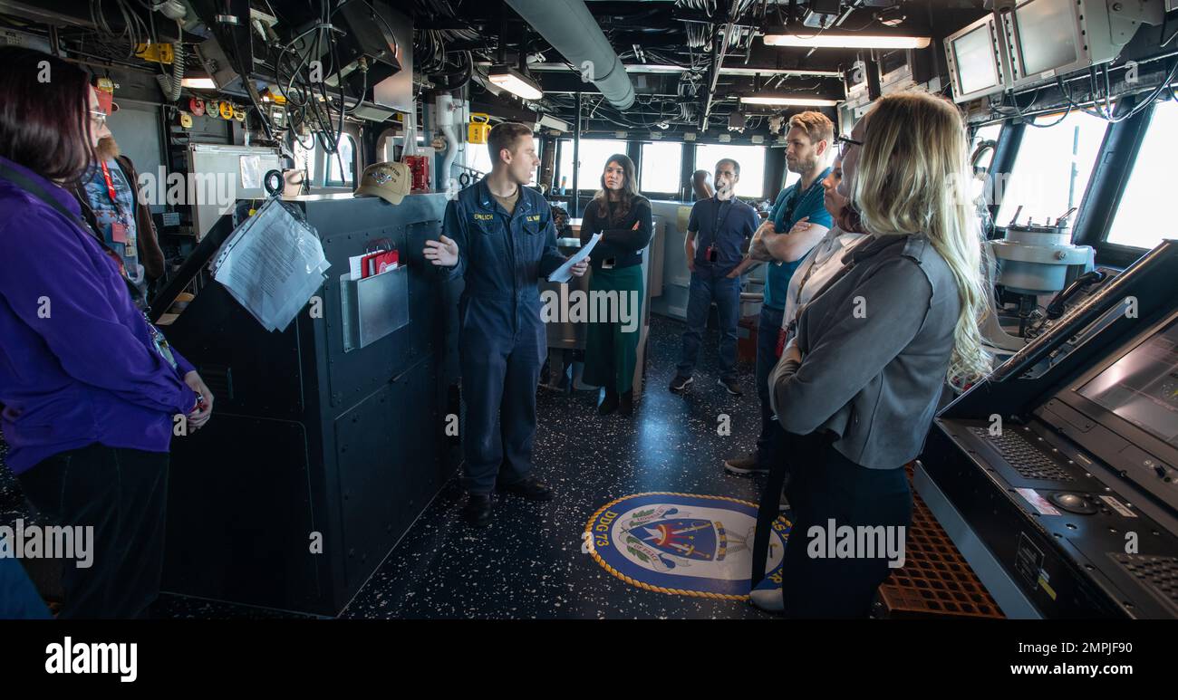 Lt. Daniel Ehrlich, center, takes a group of employees from Naval ...