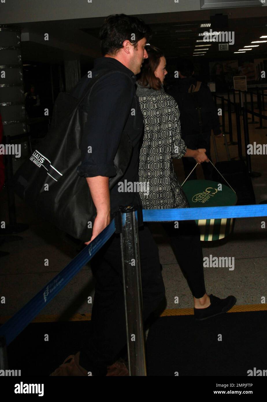 Carey Mulligan makes her way through LAX airport. The British actress was dressed casually and ...