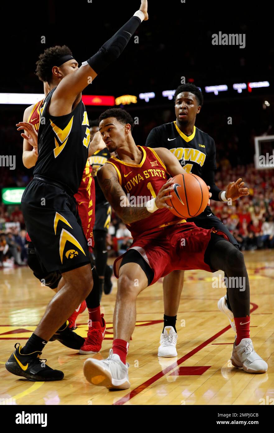 Iowa State guard Nick Weiler-Babb (1) drives between Iowa's Cordell ...