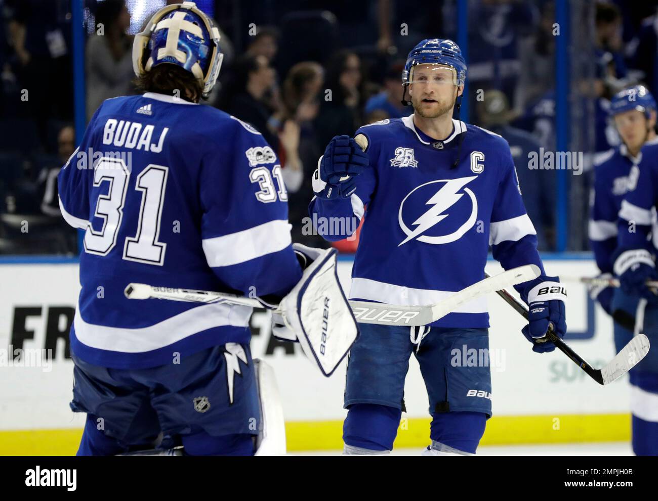 Tampa Bay Lightning center Steven Stamkos (91) celebrates with goalie ...