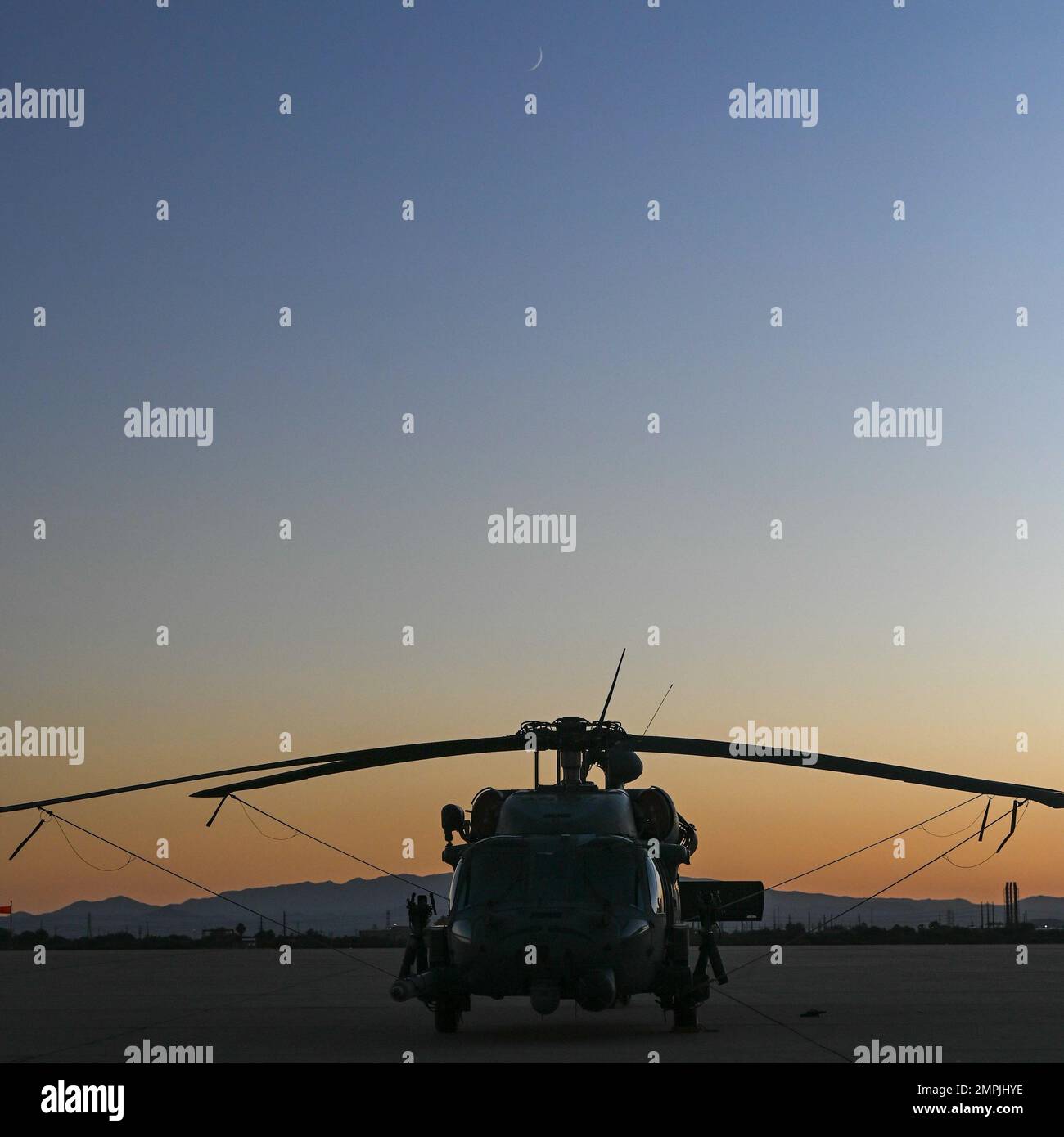 An HH-60G Pave Hawk, assigned to the 355th Wing, sits on the flight ...