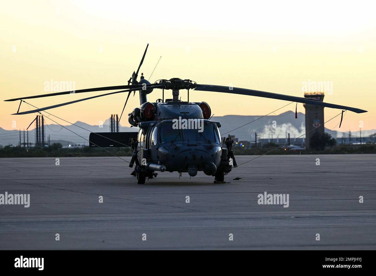 An HH-60G Pave Hawk, assigned to the 355th Wing, sits on the flight ...