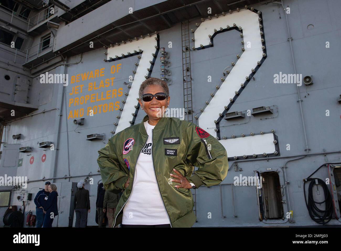 Paramount Pictures executive DeDe Lea poses for a photo wearing a Top Gun movie jacket aboard ...