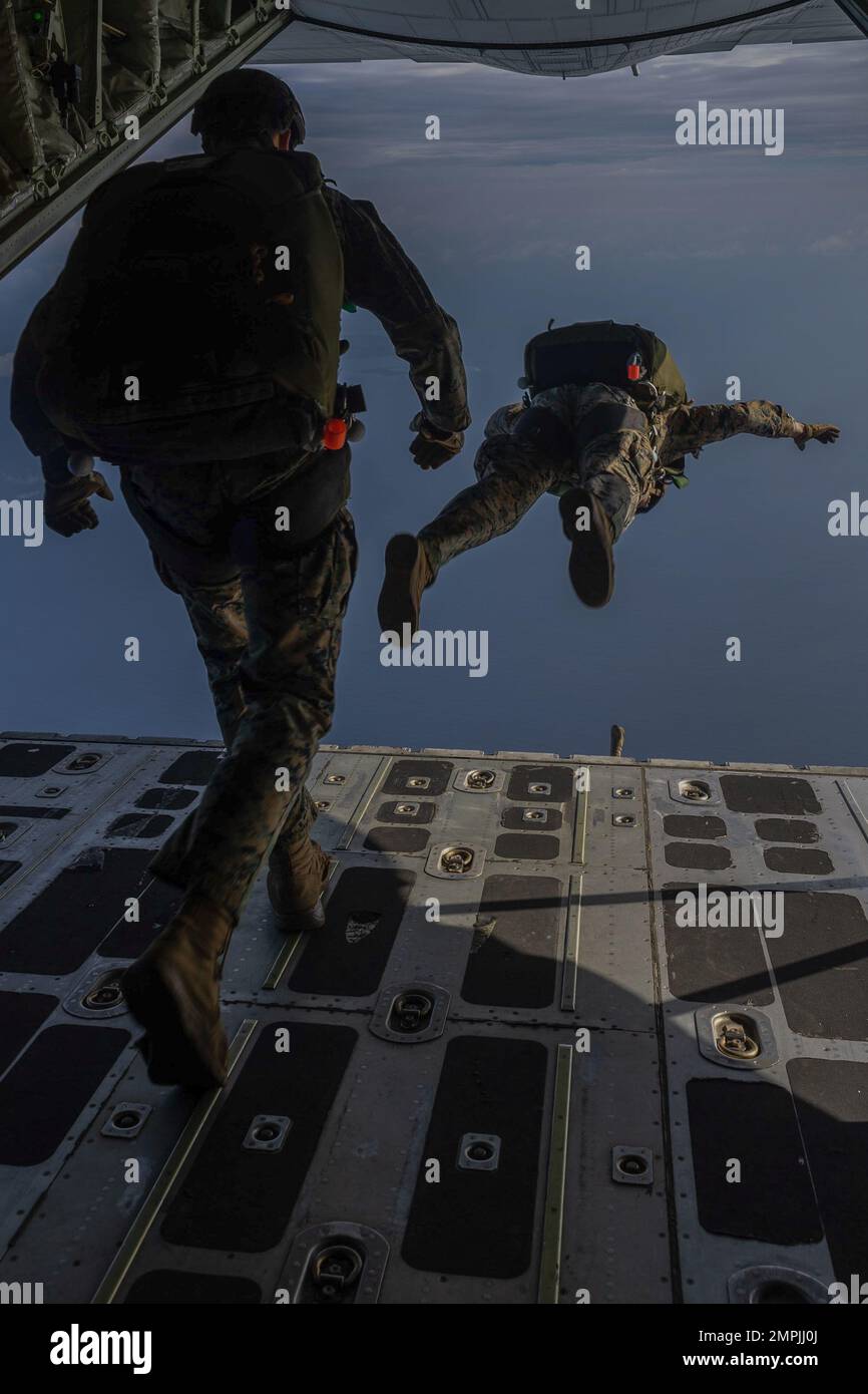 U.S. Marines with 3rd Reconnaissance Battalion perform a freefall jump ...