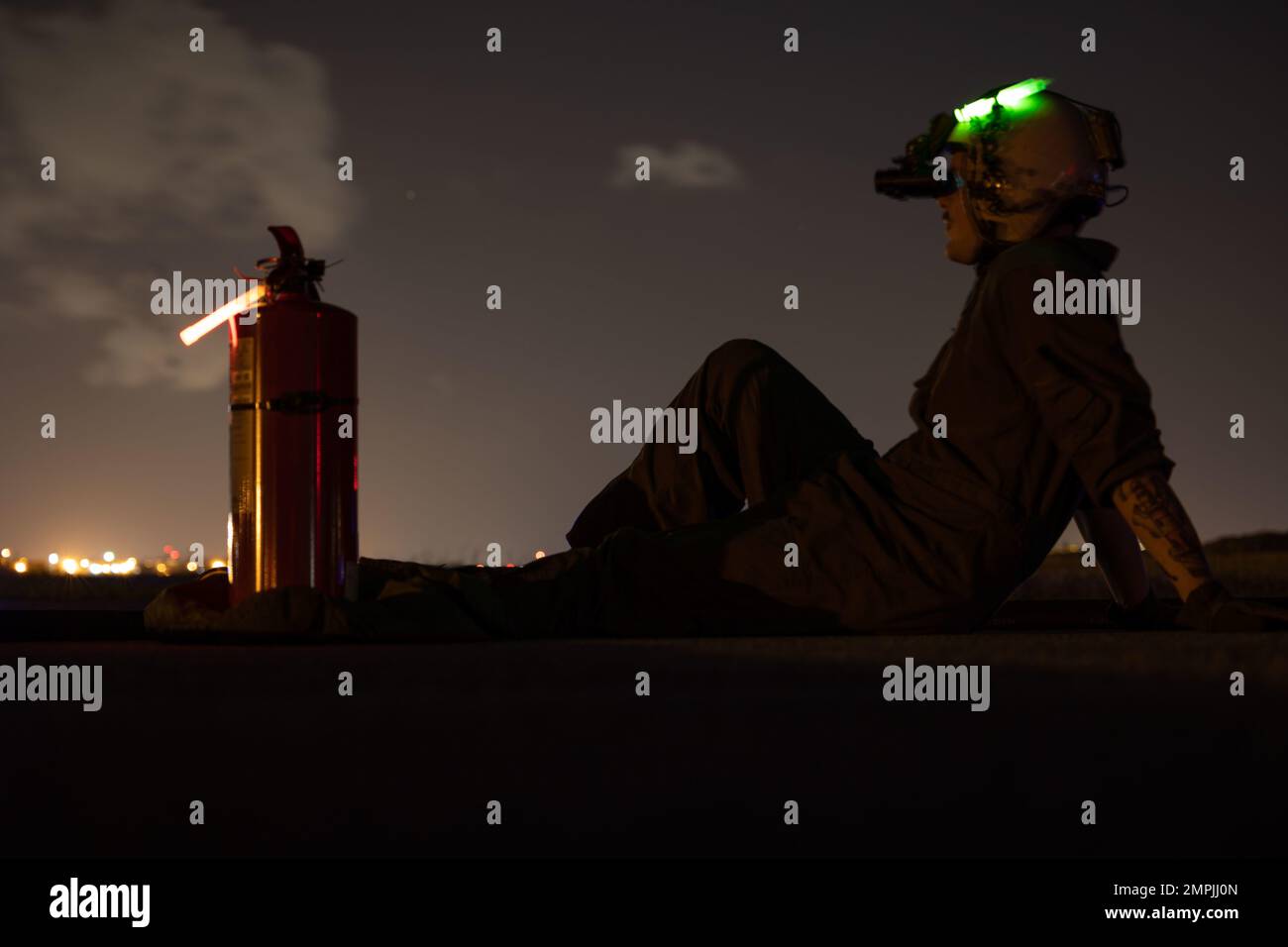 A U.S. Marine with Marine Aerial Refueler Transport Squadron (VMGR) 152 ...