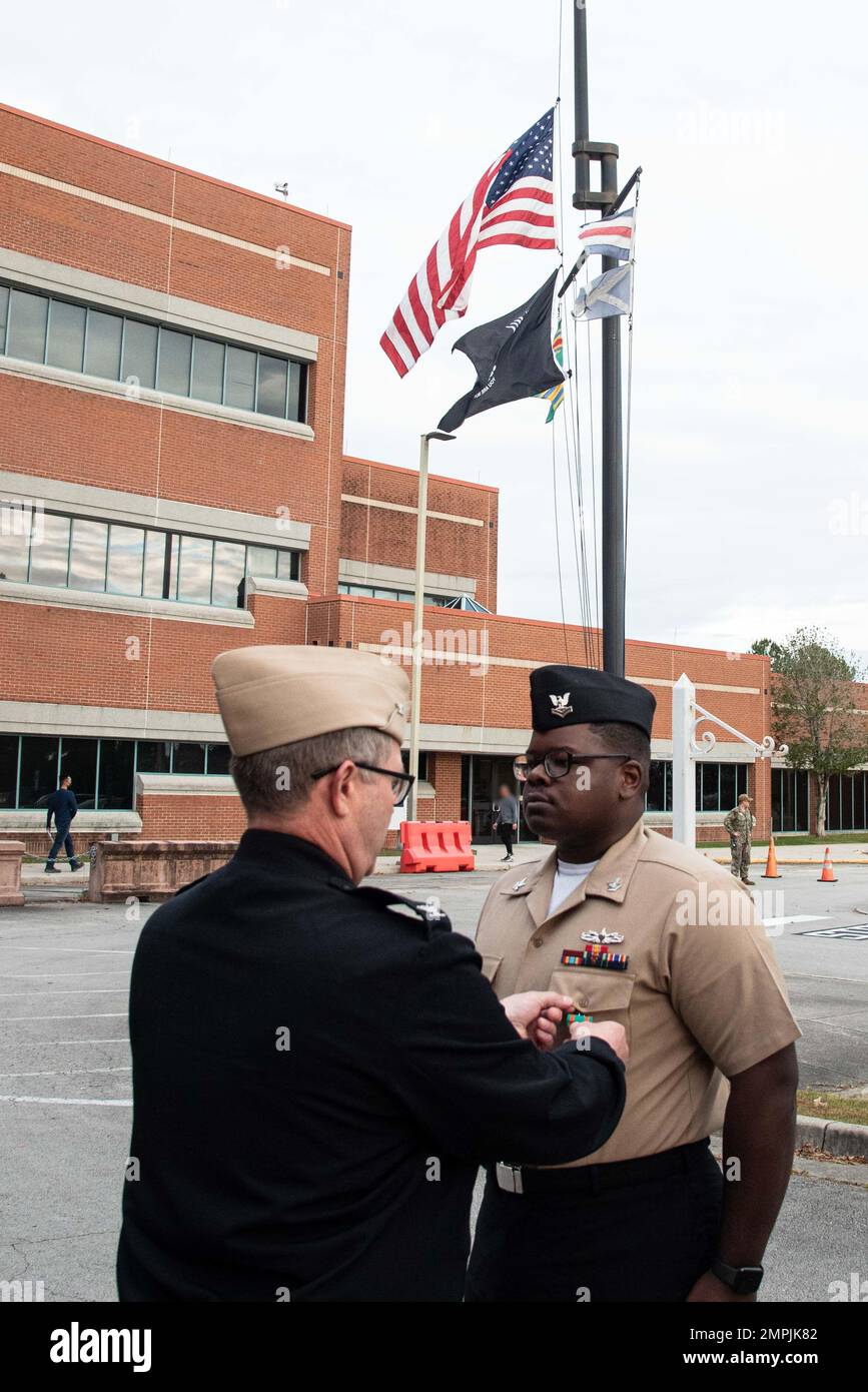 Retail Specialist Second Class Davise Angevine receives the Navy and ...