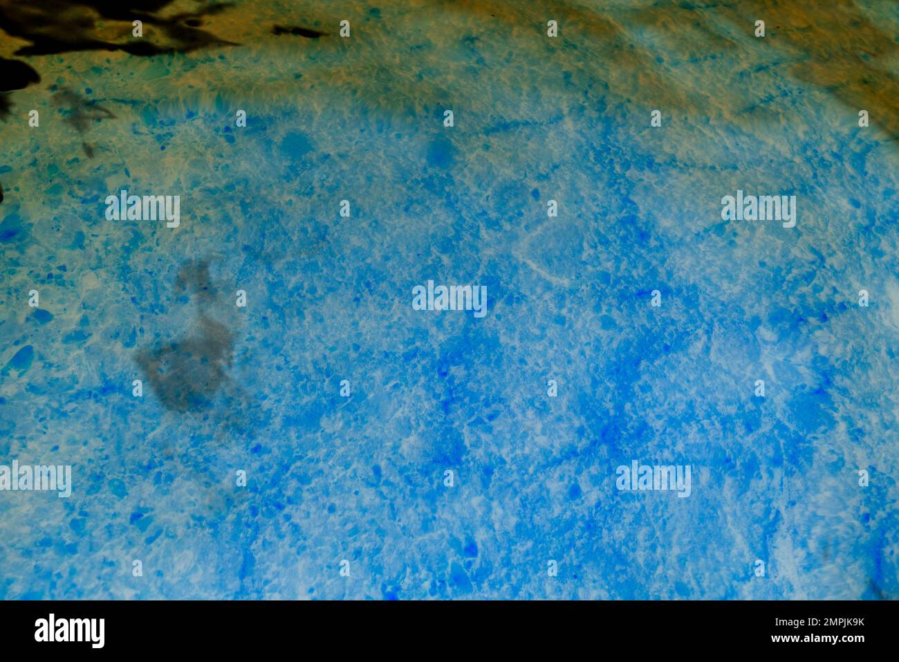 Abstract photo of a neon blue glow of transparent clear water with a ...