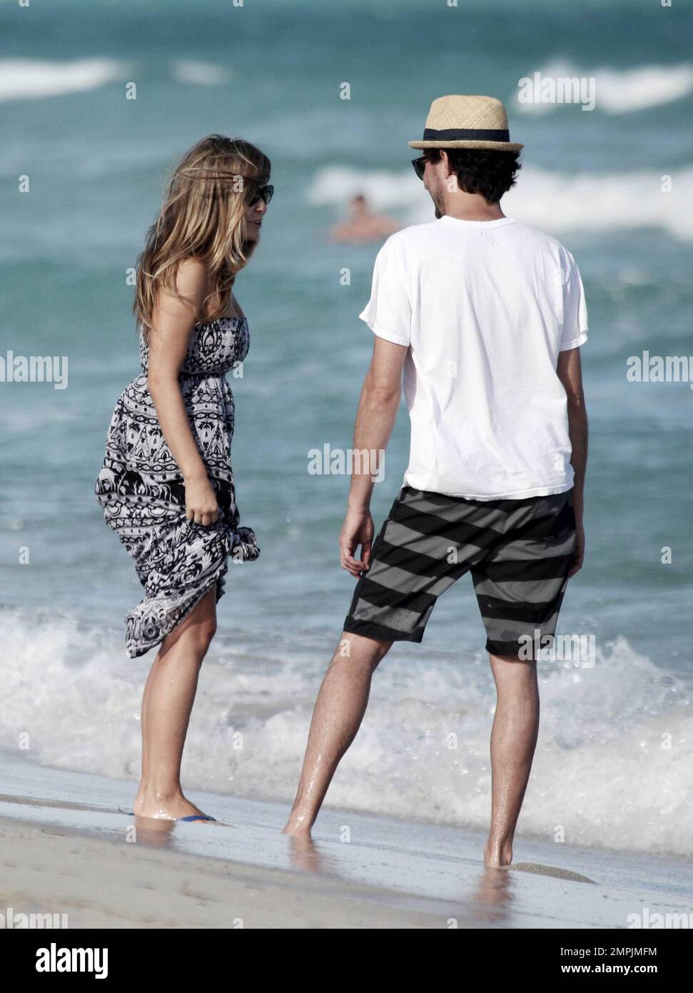 Carmen Electra looks windswept as she takes a stroll on Miami Beach in a sundress. Electra ...