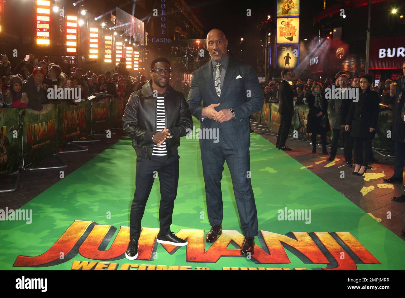 Actors Kevin Hart, left, and Dwayne Johnson poses for photographers ...