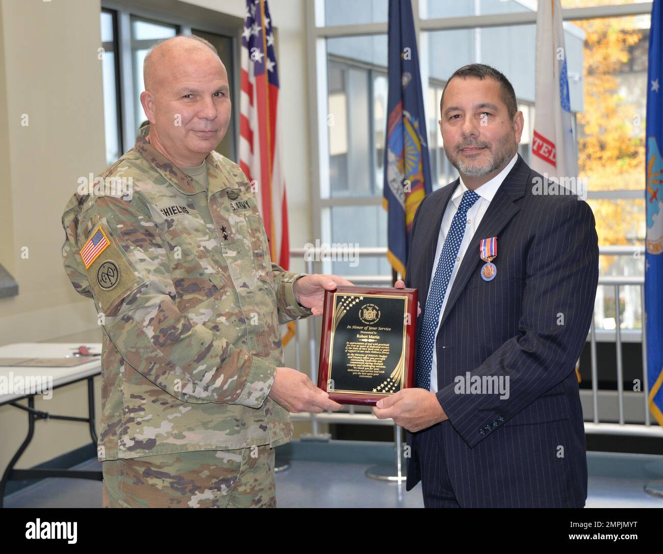 Major General Ray Shields, the adjutant general of New York, presents a ...