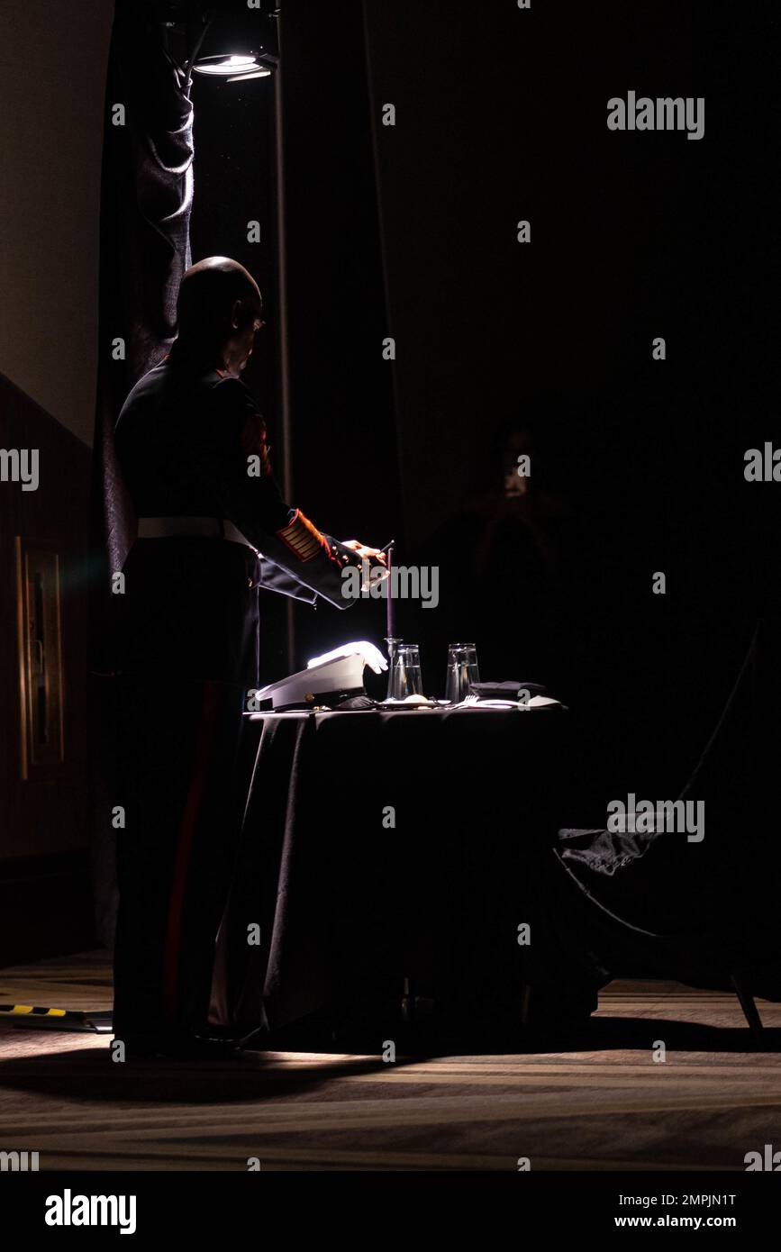 A U.S. Marine with I Marine Expeditionary Force lights the candle at ...