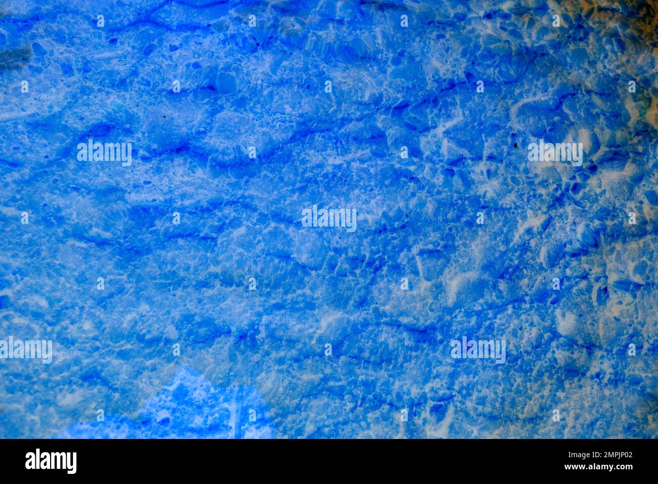 Abstract photo of neon blue glow of transparent clear water with waves ...